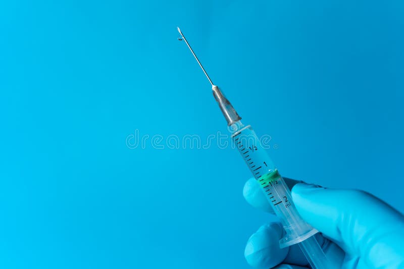 Close-up of a Hand in the Lower Right Corner of the Image Holding a ...