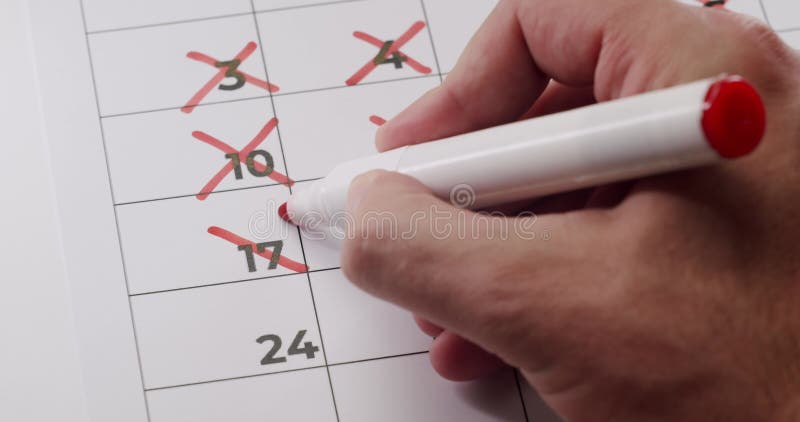 Hand Crossing Off Dates on Calendar with Red Marker Pen Stock Video ...