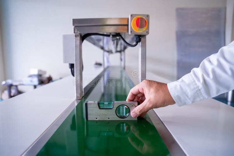 Close Up of Hand Mechanic Technician Worker Use a Water Level Meter ...