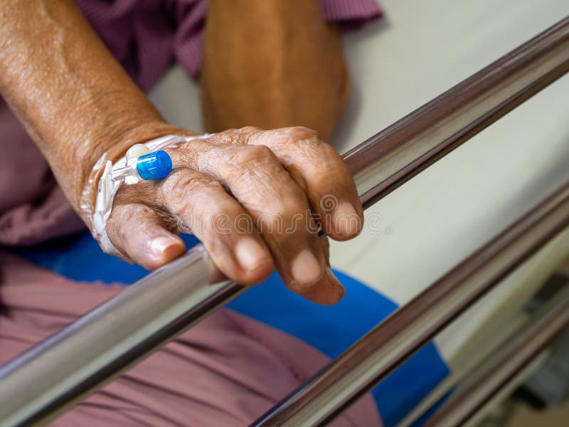 Close Up Hand Patient Elderly Man Hand with Saline Intravenous Iv ... Close Up Hand Patient Elderly Man Hand with Saline Intravenous Iv ...