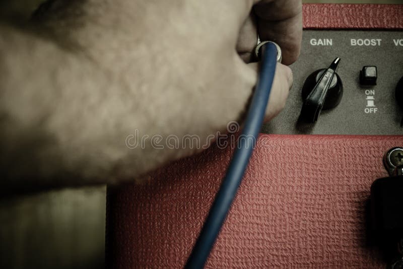 Close Up of Hand Plugging in Jack on Amp Stock Photo - Image of ...