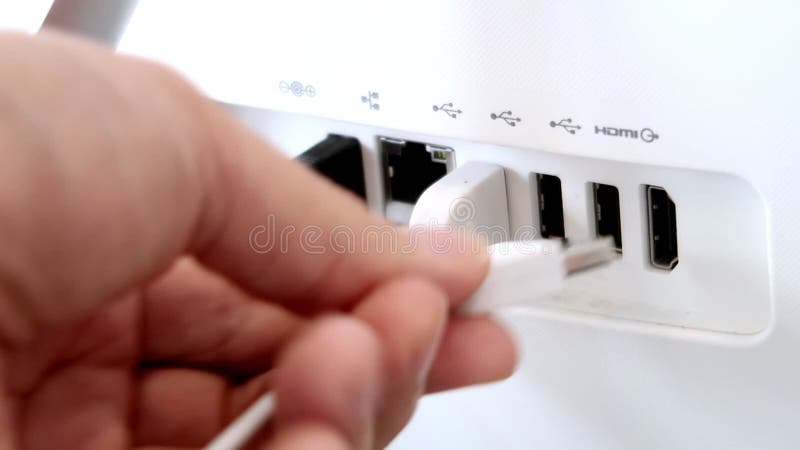 Close Up the Hand is Plugging the USB Port Behind the Computer Stock ...