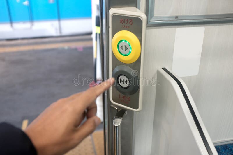 Close Up of a Hand Pressing a Button Inside a Modern Train Stock Image ...