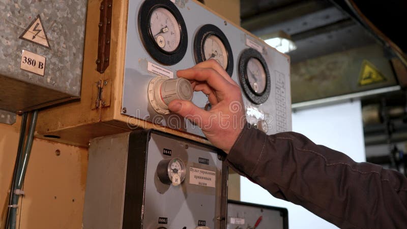 The Worker Presses the Button on the Control Panel of the Mechanism ...