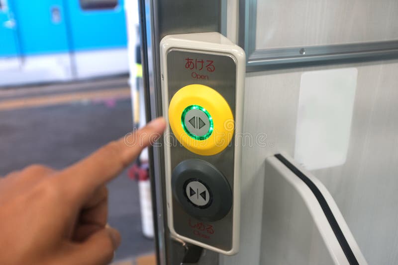 Close Up of a Hand Pressing a Button Inside a Modern Train Stock Photo ...