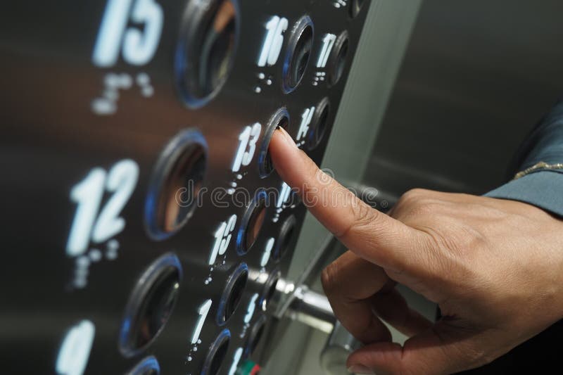 Close-up of a Hand Pressing Elevator Button on the Floor Panel Stock ...