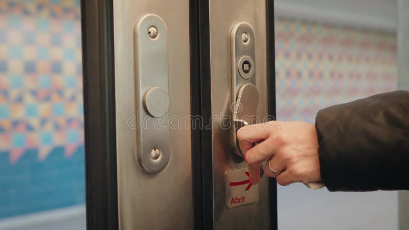 Hand Pressing Metal Door Handle Indoors Symbolizing Access and Securing ...