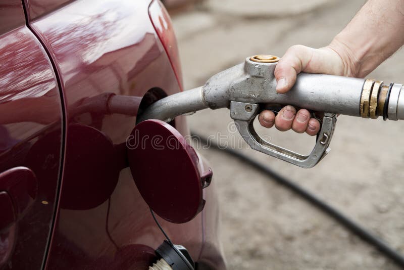 Close-up of a Hand Pumping Gas in the Car Stock Photo - Image of ...