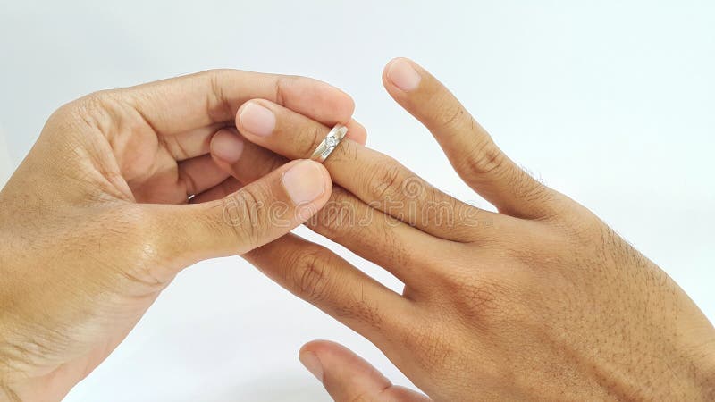 Close Up of Hand Putting a Ring on the Ring Finger Stock Photo - Image ...
