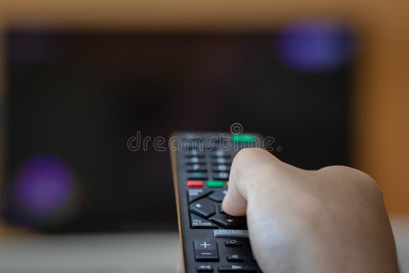 Close-up of Hand with the Remote Control Television and Presses the ...