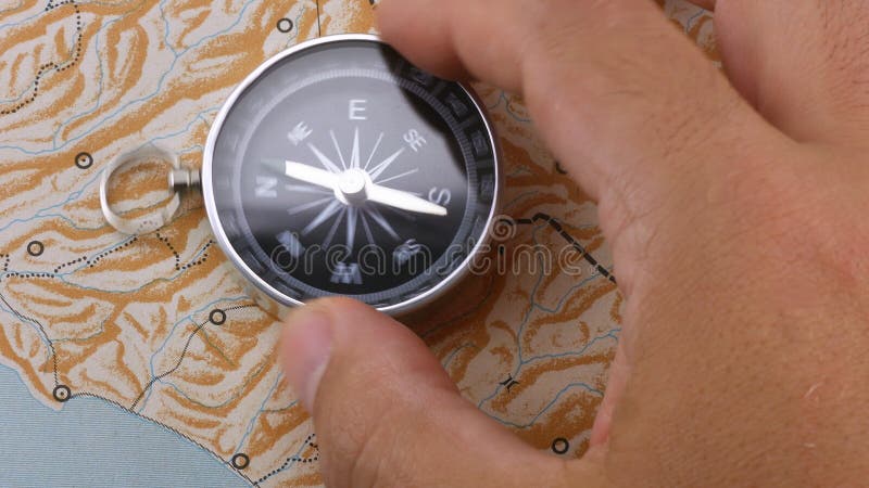 Close Up Hand Rotating Compass on Blank Map Stock Footage - Video of ...