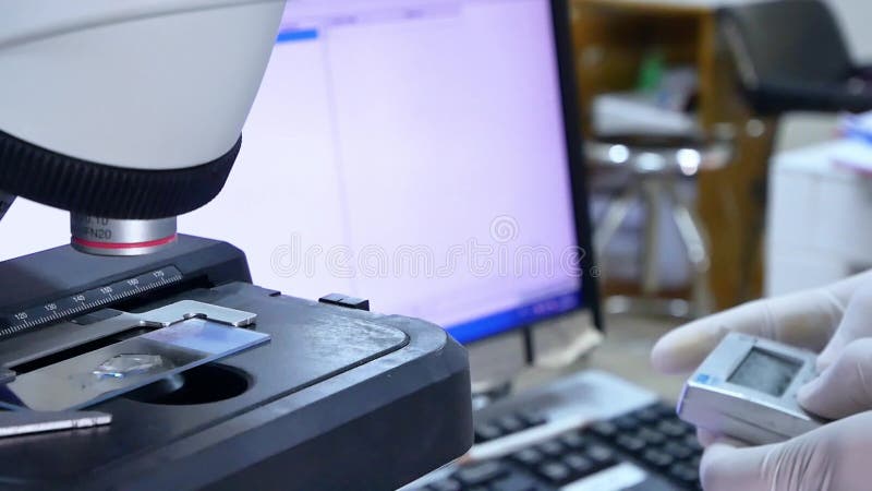 Close Up Hand Scientist Using Light Microscope. Stock Video - Video of ...