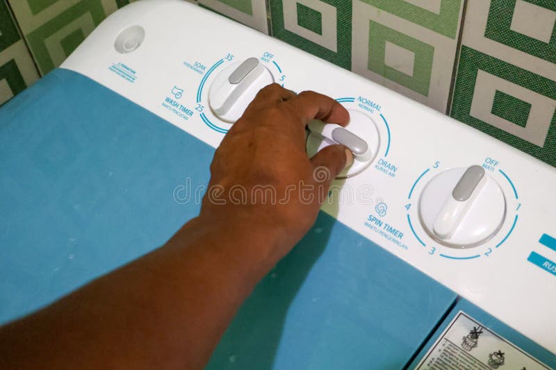 Close Up Hand Selecting Washing Program on Washing Machine Stock Photo ...