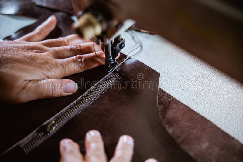 Close Up of Hand Sewing a Zipper Onto Leather Stock Photo - Image of ...