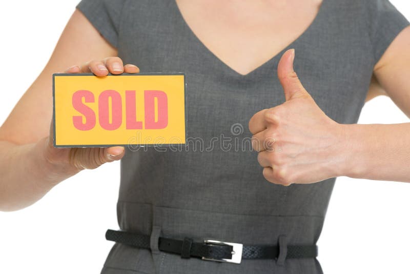 Close Up on Hand with Sold Sign and Hand Showing T Stock Photo - Image ...