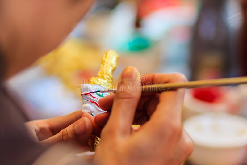 Close Up Hand of Thai Sculptor during Painting the Masterpiece O Stock ...