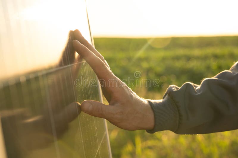 Close-up of a Hand Touching a Solar Panel at Sunset Stock Photo - Image ...