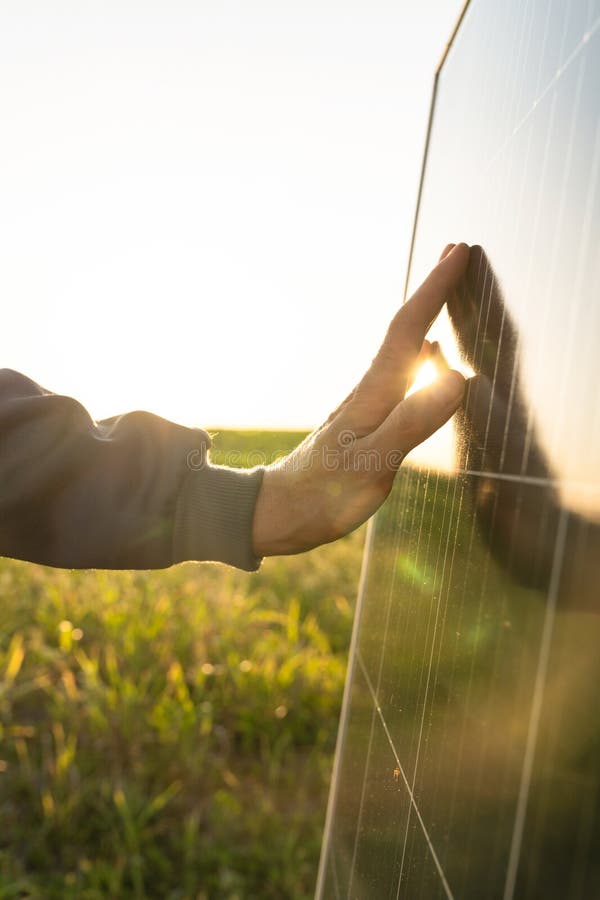 Close-up of a Hand Touching a Solar Panel at Sunset Stock Image - Image ...