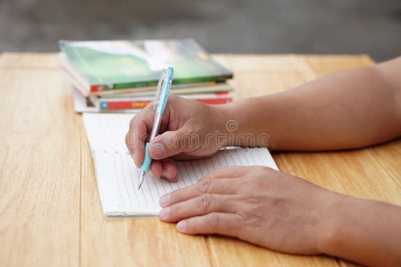 Close Up Hand Use Pen To Write on Paper Notebook. Stock Photo - Image ...