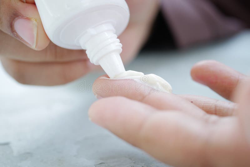 Close Up of Hand Using Sunscreen Cream Stock Photo - Image of ...
