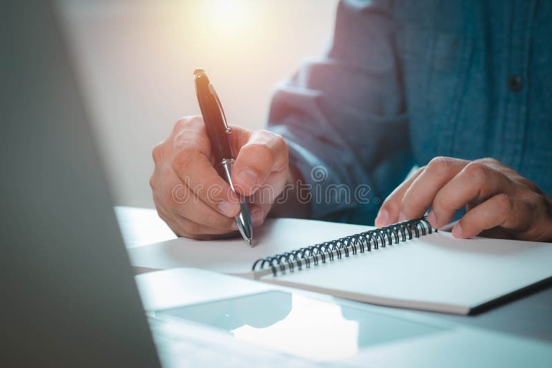 Close-up of Hand Using Writing Pen with Questionnaire or Paperwork ...