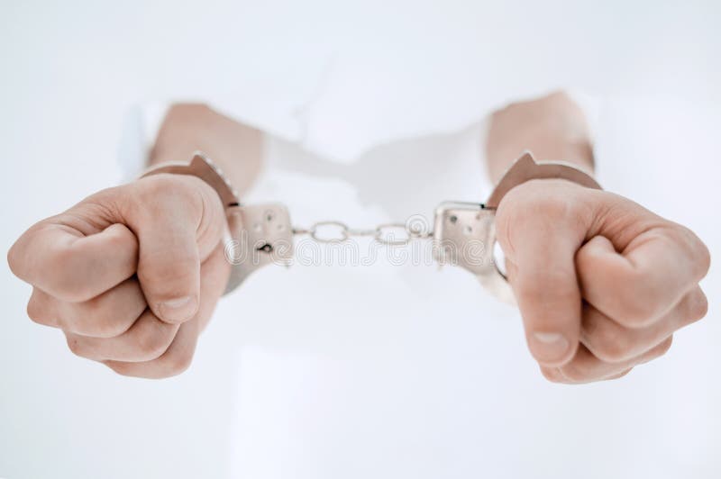 Close up.handcuffed hands stock image. Image of cuffs - 129508541