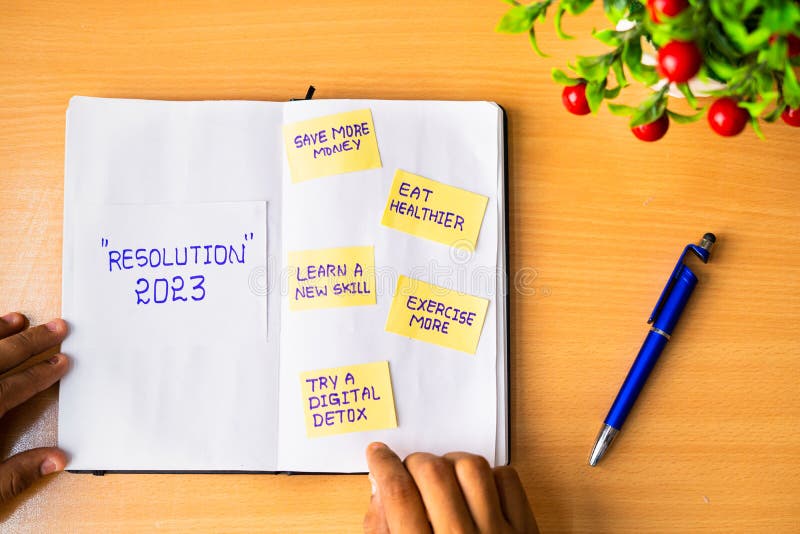 Close Up of Hands Adding Making Note of New Year 2023 Resolutions on ...