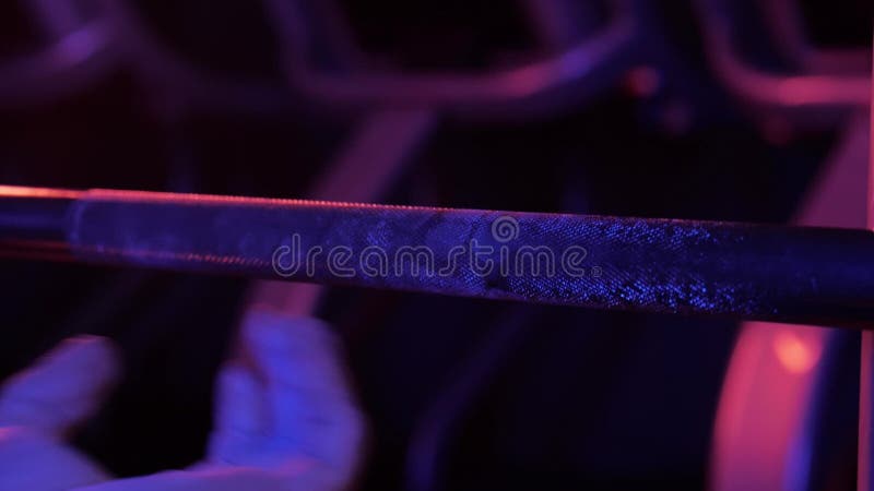 Close-up on Hands: Bodybuilder Puts Additional Weights on a Barbell ...