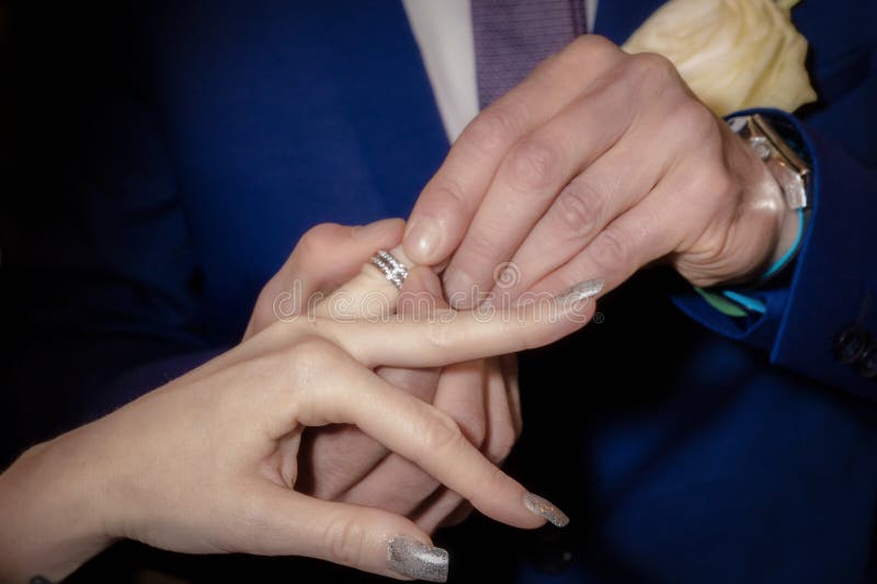 Close Up Hands of Bride and Groom Putting on a Wedding Rings Stock ...