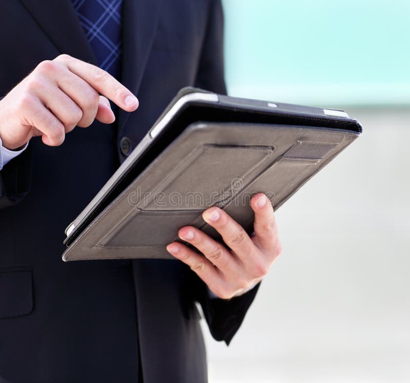 Close Up of the Hands of the Businessman with a Tablet PC Stock Photo ...