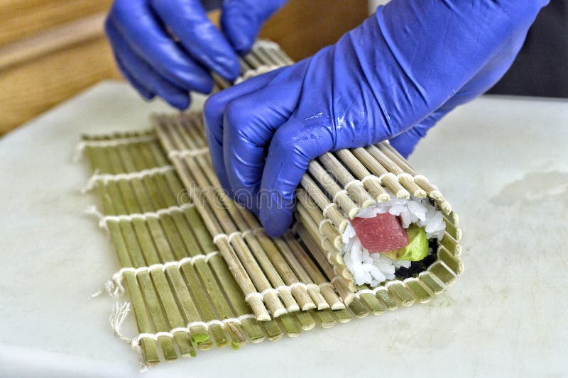 Close-up of the Hands of a Chef Making Sushi. Stock Image - Image of ...