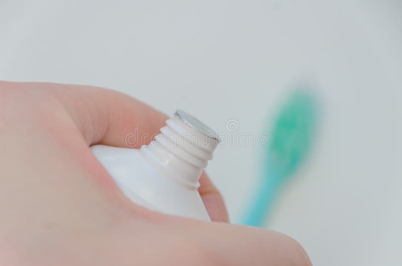 In the Hands of a Closed Toothpaste, Close-up Stock Image - Image of ...