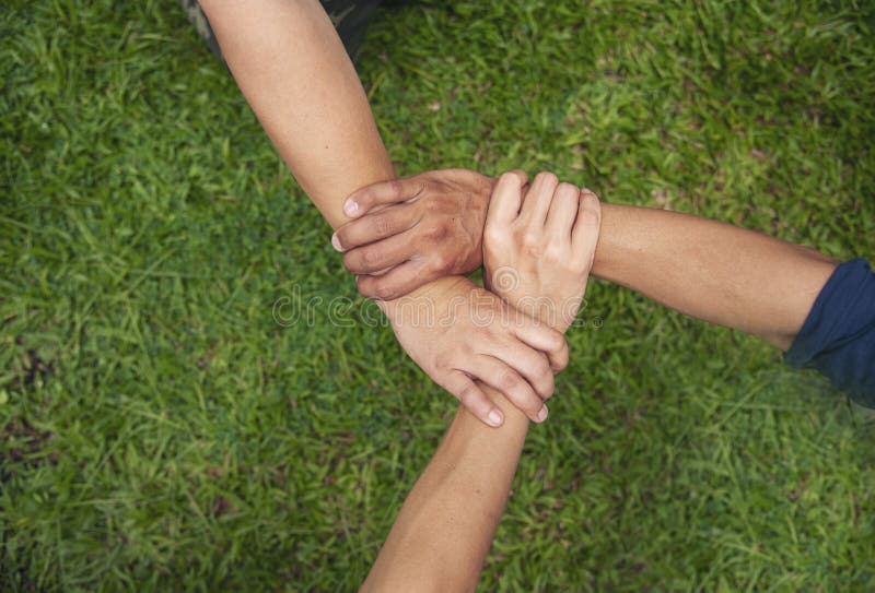 Close Up Hands Diverse Multiethnic Partners Team Together. Teamwork ... Close Up Hands Diverse Multiethnic Partners Team Together. Teamwork ...