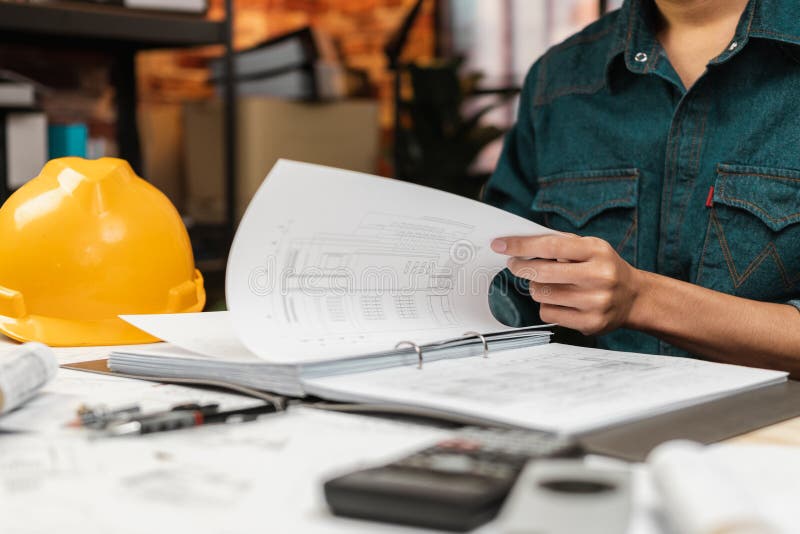 Close Up Hands of an Engineer Reading and Checking on Blueprints Paper ...