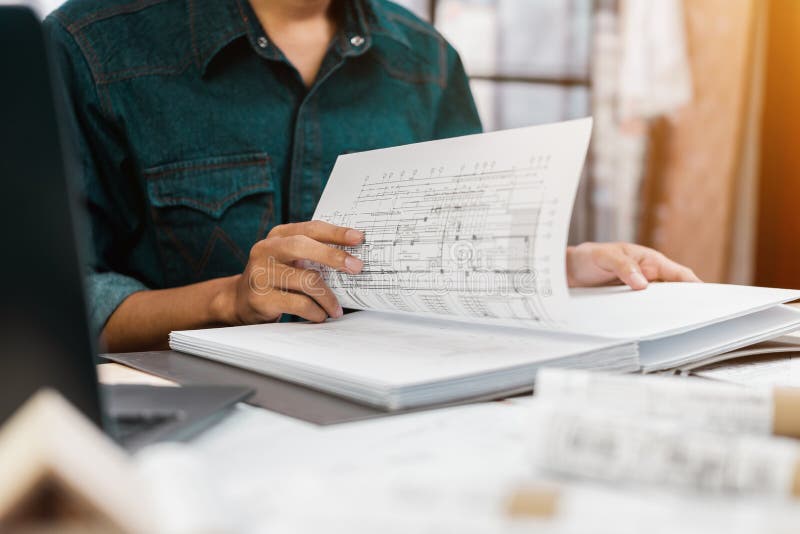 Close Up Hands of an Engineer Reading and Checking on Blueprints Paper ...