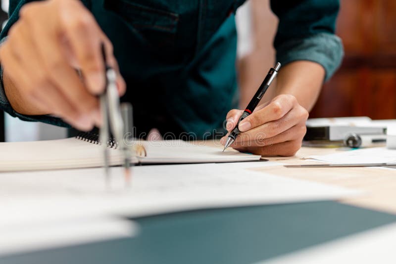Close Up Hands of an Engineer Working and Checking on Blueprints ...