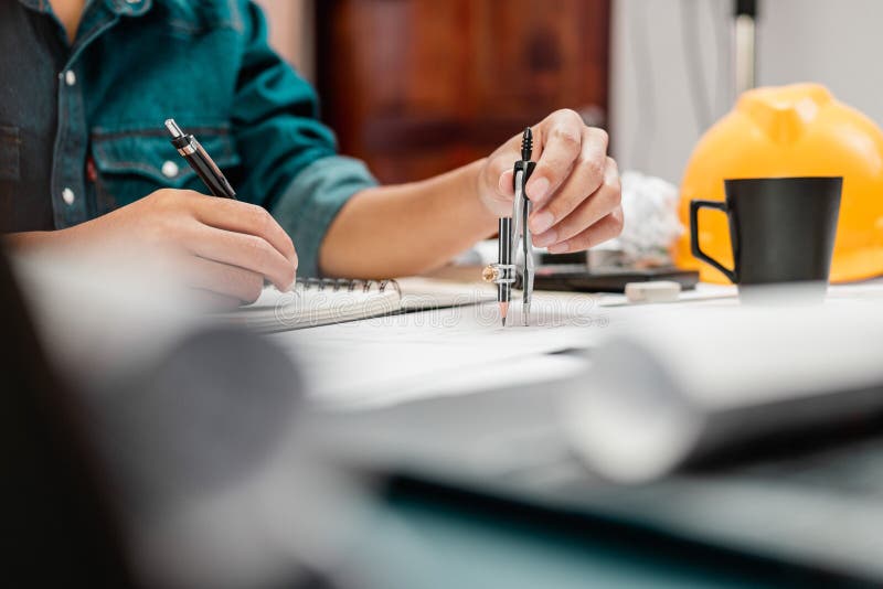 Close Up Hands of an Engineer Working and Checking on Blueprints ...