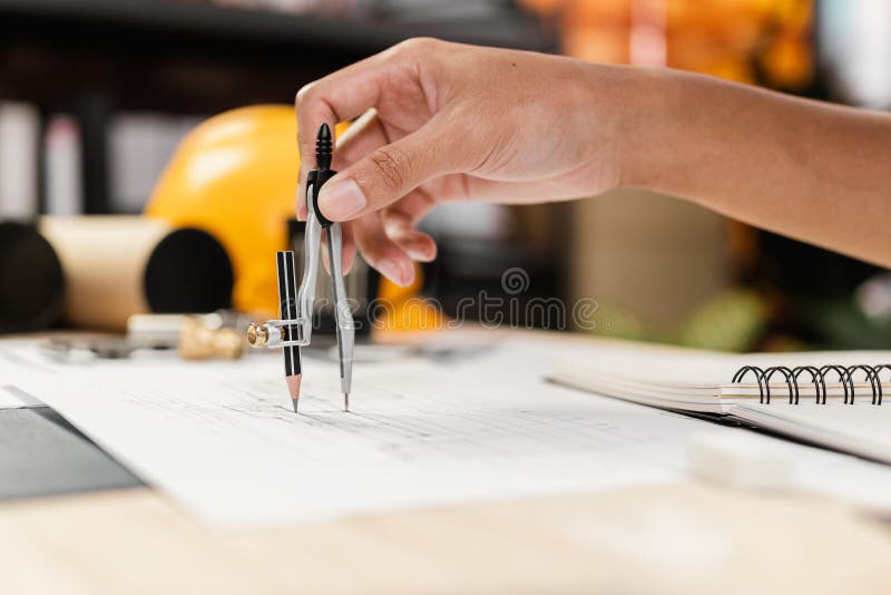 Close Up Hands of an Engineer Working and Checking on Blueprints ...