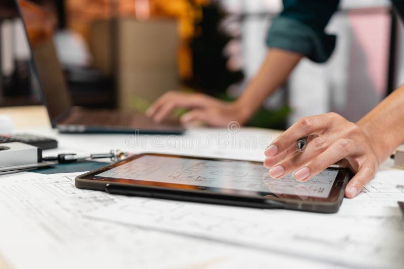 Close Up Hands of an Engineer Working and Checking on Blueprints with ...