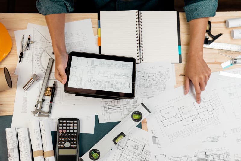 Close Up Hands of an Engineer Working and Checking on Blueprints with ...