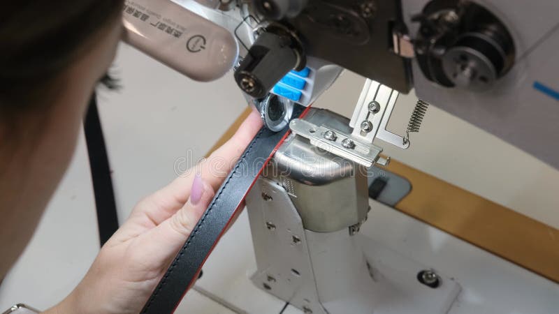 Person Operating Precision Sewing Machine in Workshop during Daytime ...