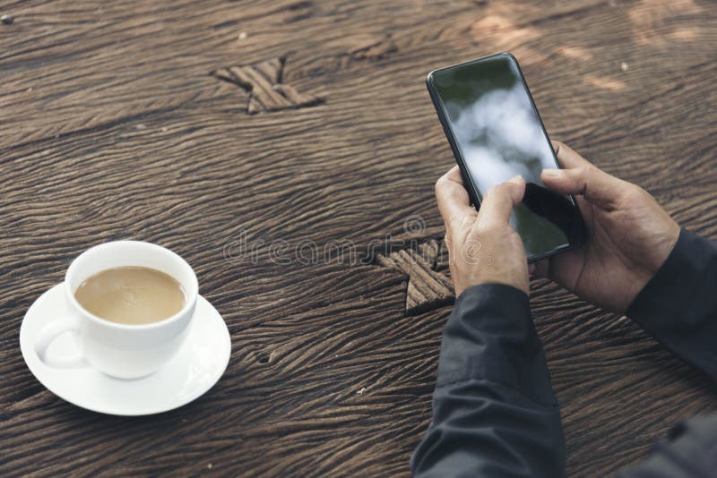 Close Up Hands of Handsome Man Using Smart Phone in a Coffee Cafe Stock ...