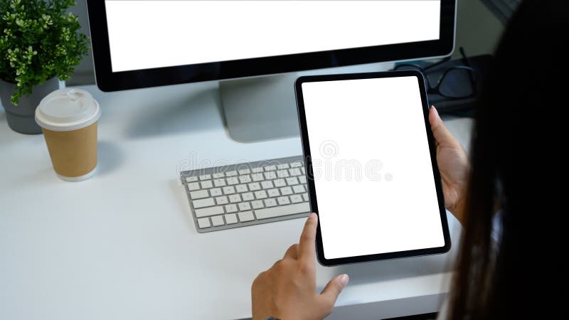 Close Up of Hands Holding Blank Screen Tablet in a Modern Workspace ...