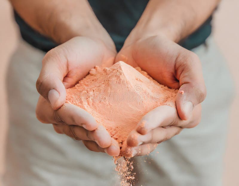 Close-up of Hands Holding Peachy Orange Powder Stock Illustration ...