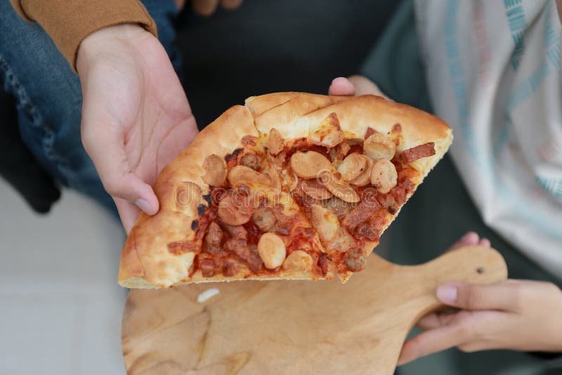 Hands Holding a Slice of Pizza Stock Image - Image of hand, holding ...