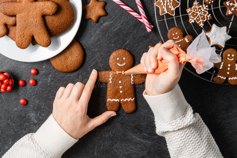 Close Up of Hands Icing Gingerbread Cookies Stock Photo - Image of ...