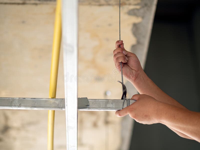 Close-up of Construction Worker Hands Adjusting Metal Frame with Wire ...