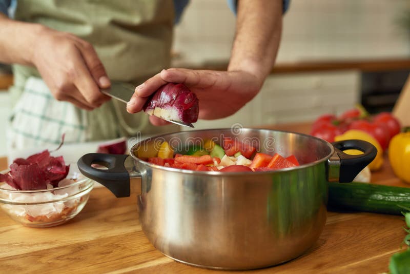 Close Up of Hands of Man, Chef Cook Adding Onion To the Pot with ...