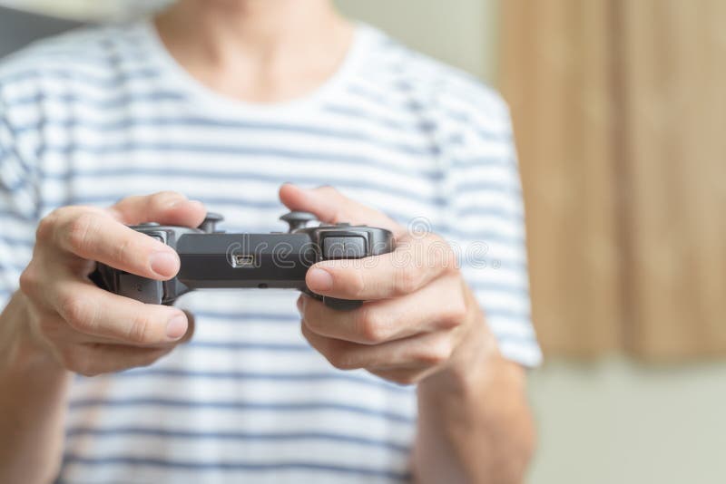 Close Up Hands of Man, Gamer Using Gaming Controller or Game Pad when ...
