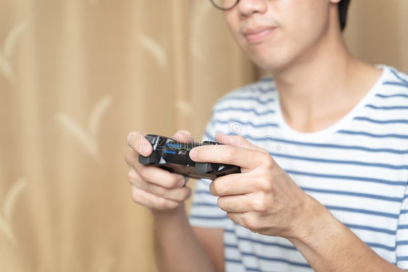 Close Up Hands of Man, Gamer Using Gaming Controller or Game Pad when ...